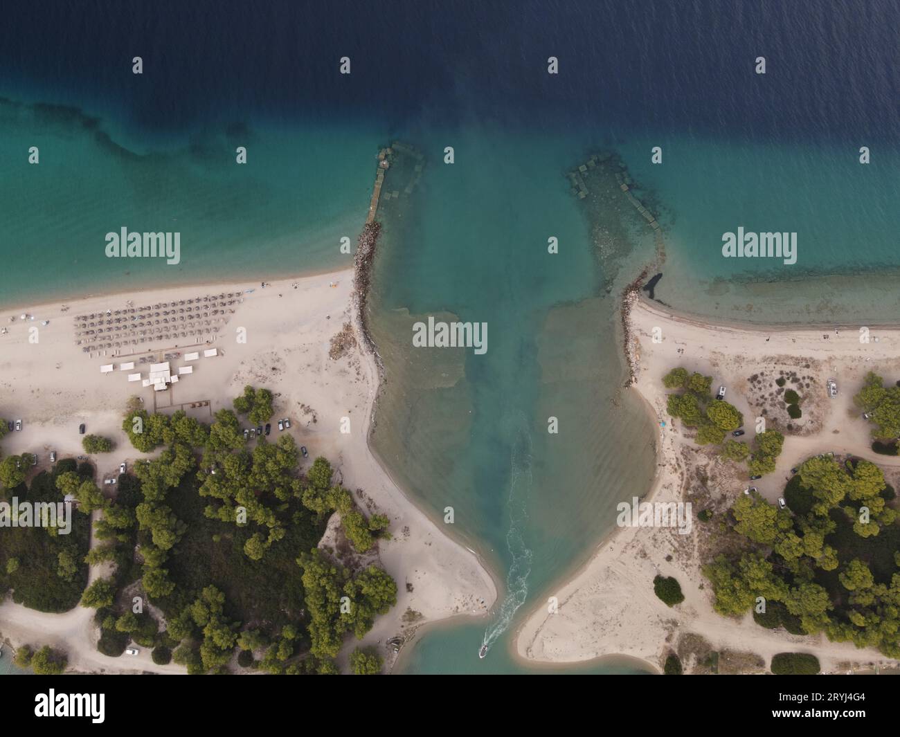 Overhead drone photo over the tropical blue ocean and the bay of ...