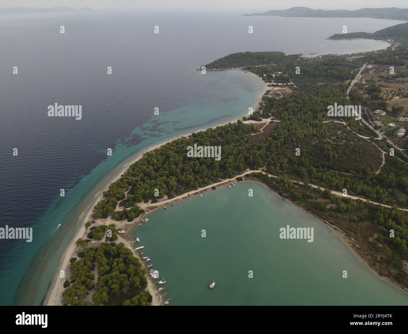 Overhead drone photo over the tropical blue ocean and the bay of ...