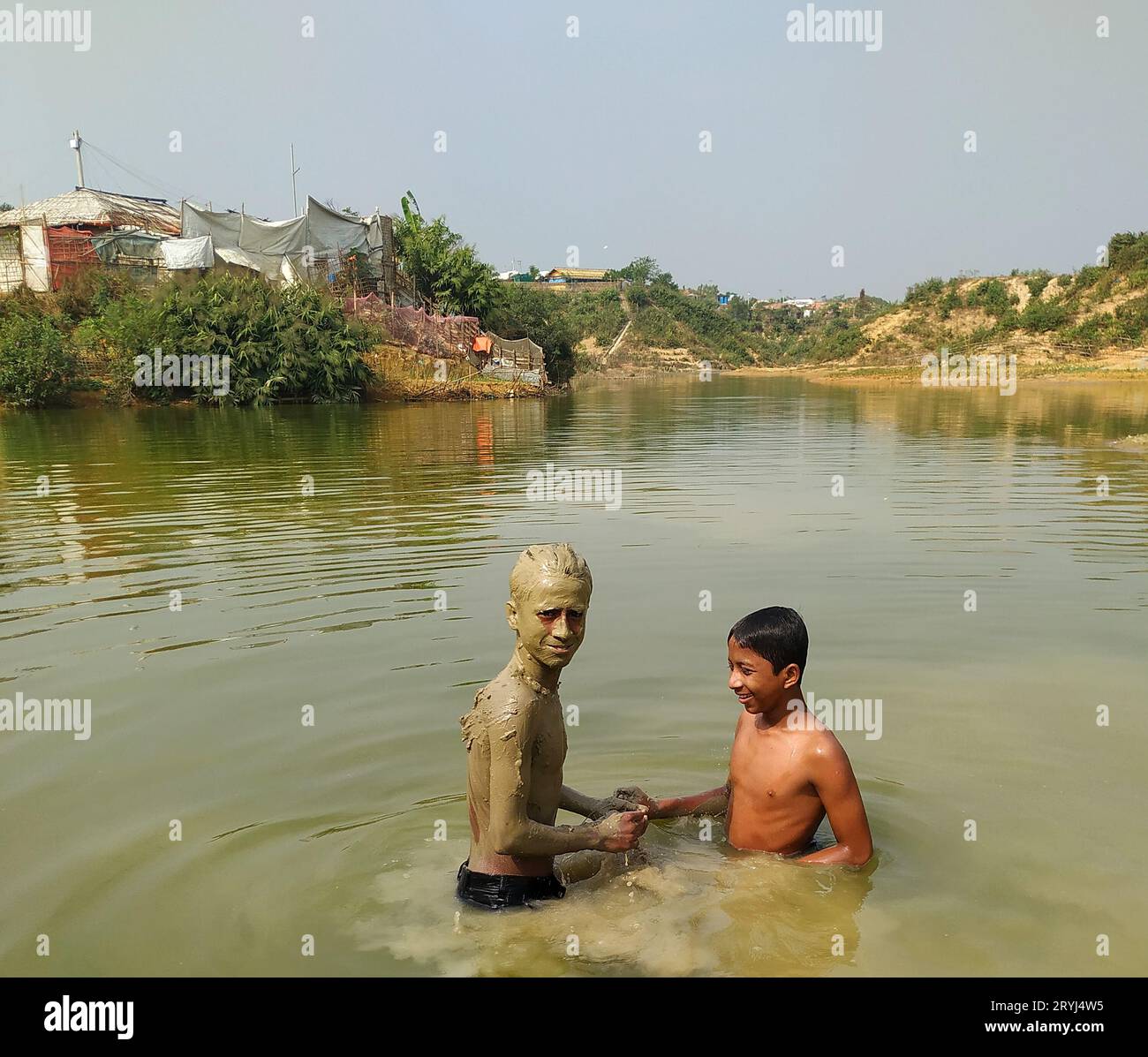 Boy in mud bath hi-res stock photography and images - Alamy