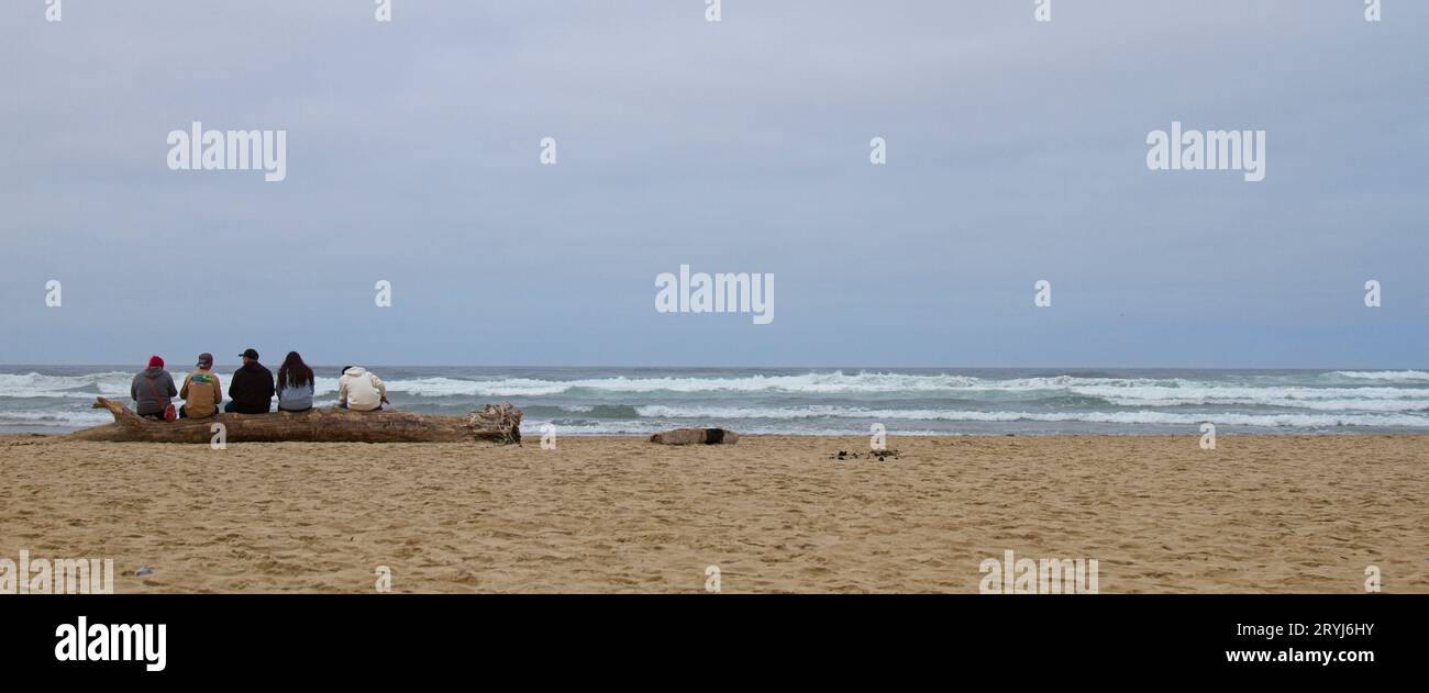 Coastal Gathering: People Enjoying Beach Fun Under Sunny Skies Stock ...