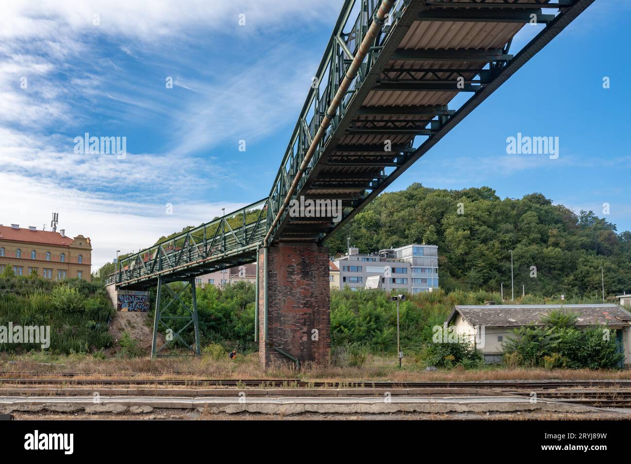 Pedestrian footbridge over a train yard, look from below. Station "Praha-Smíchov - severní ...