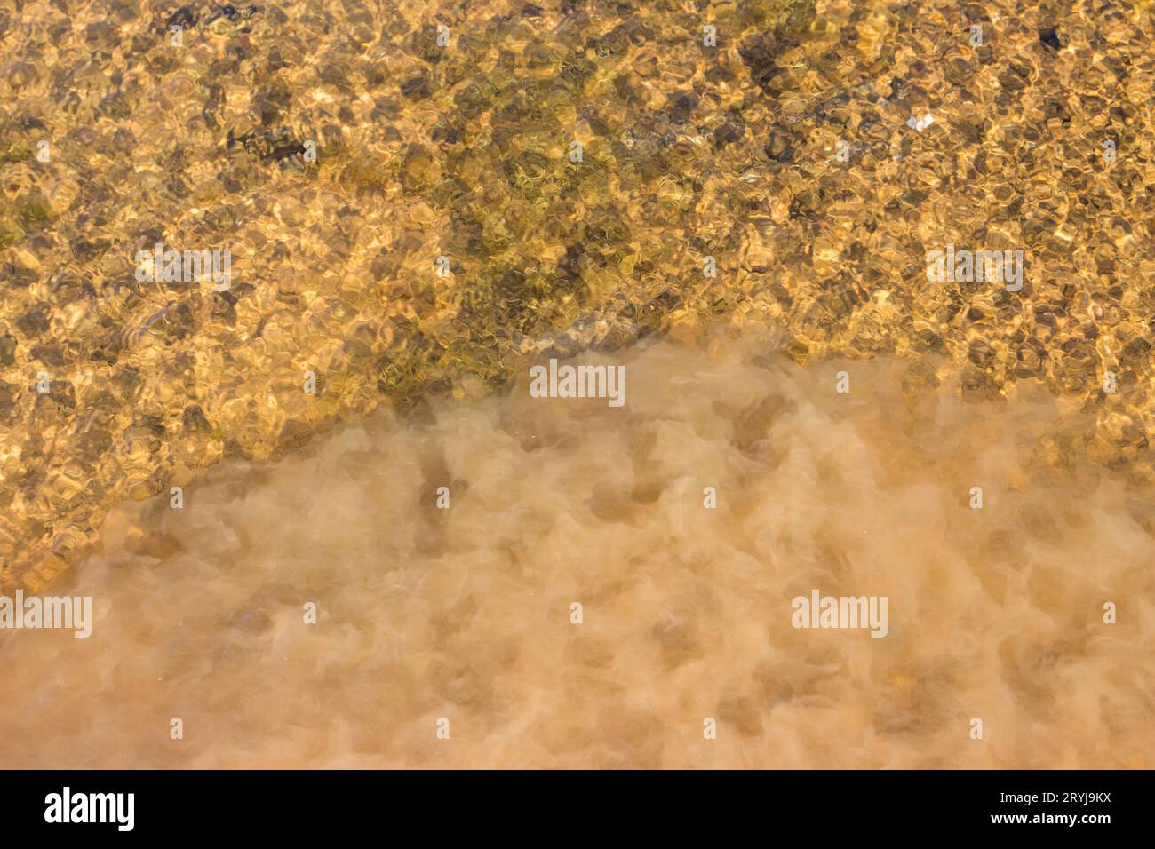 Clean water in a reservoir is covered with silt raised from the bottom ...