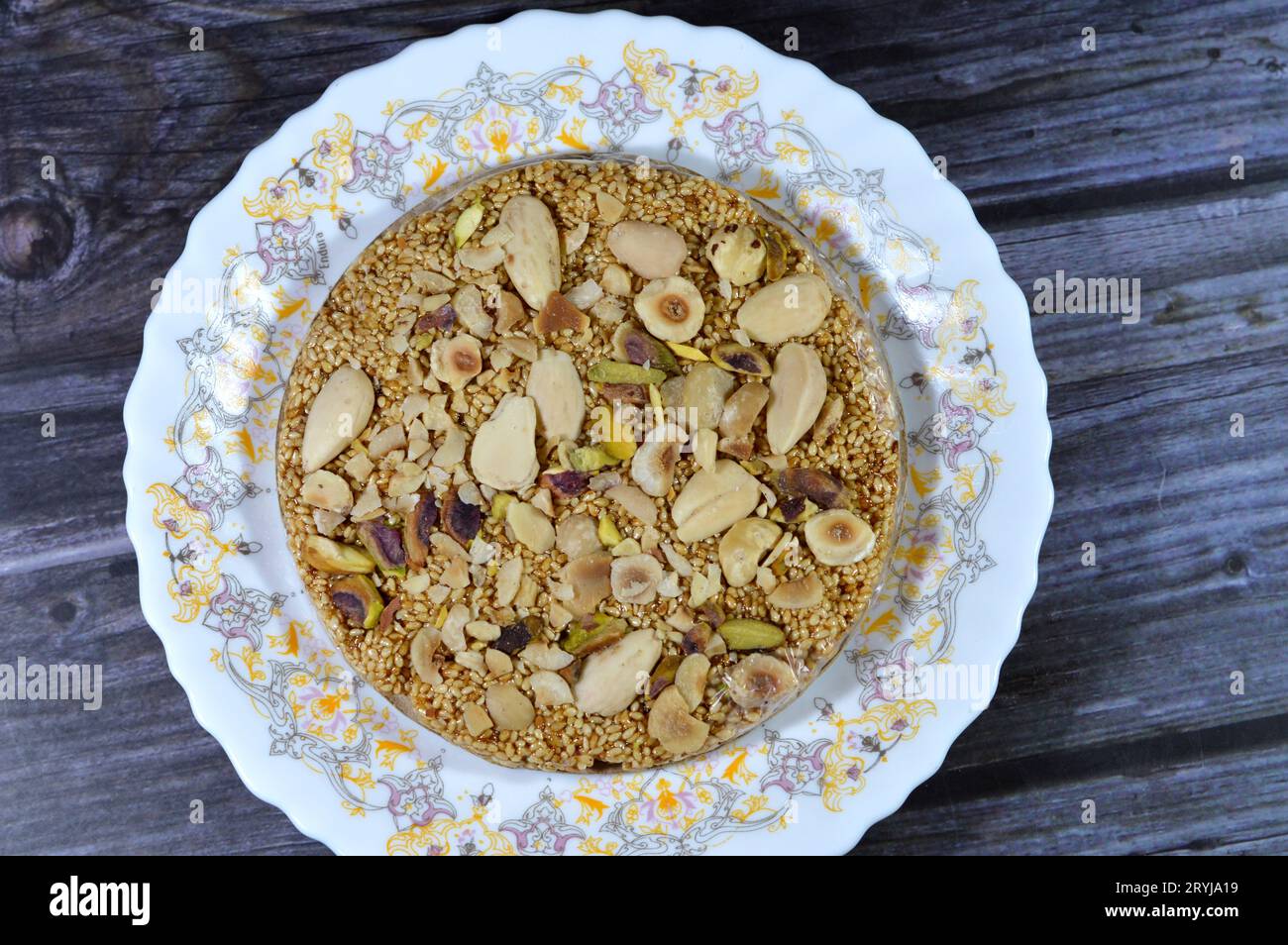 Confectionery sweet circular Eastern candy made of sugar, sesame, nuts ...