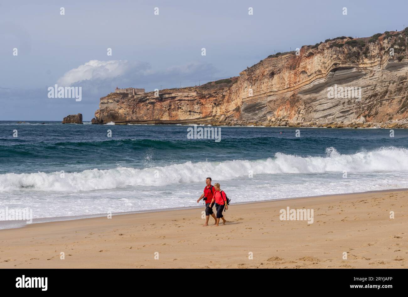 Tourists and visitors to the windy surfing beaches of Nazare in ...