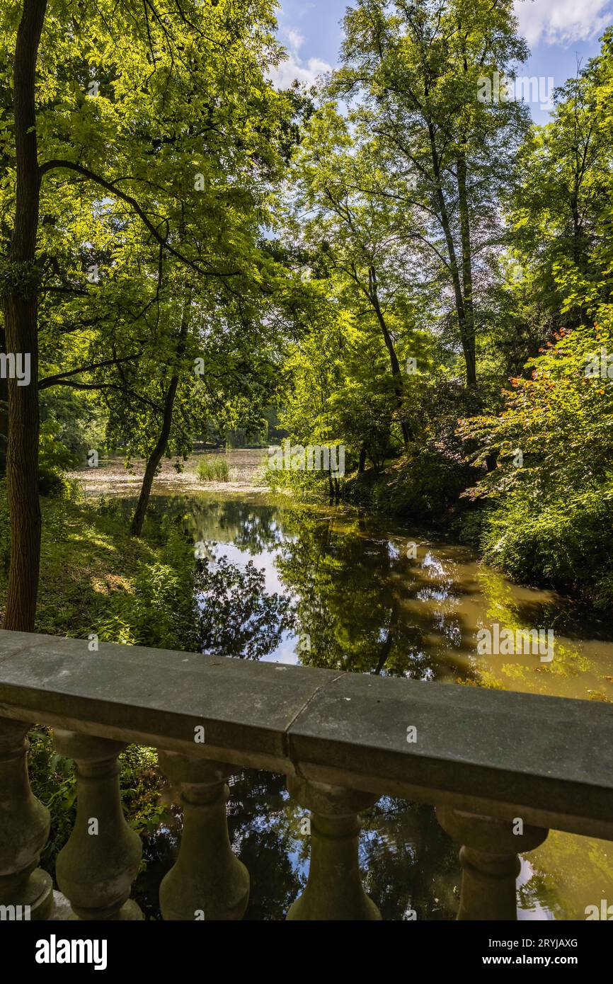 Small stream in beautiful park with colorful surroundings seen from ...