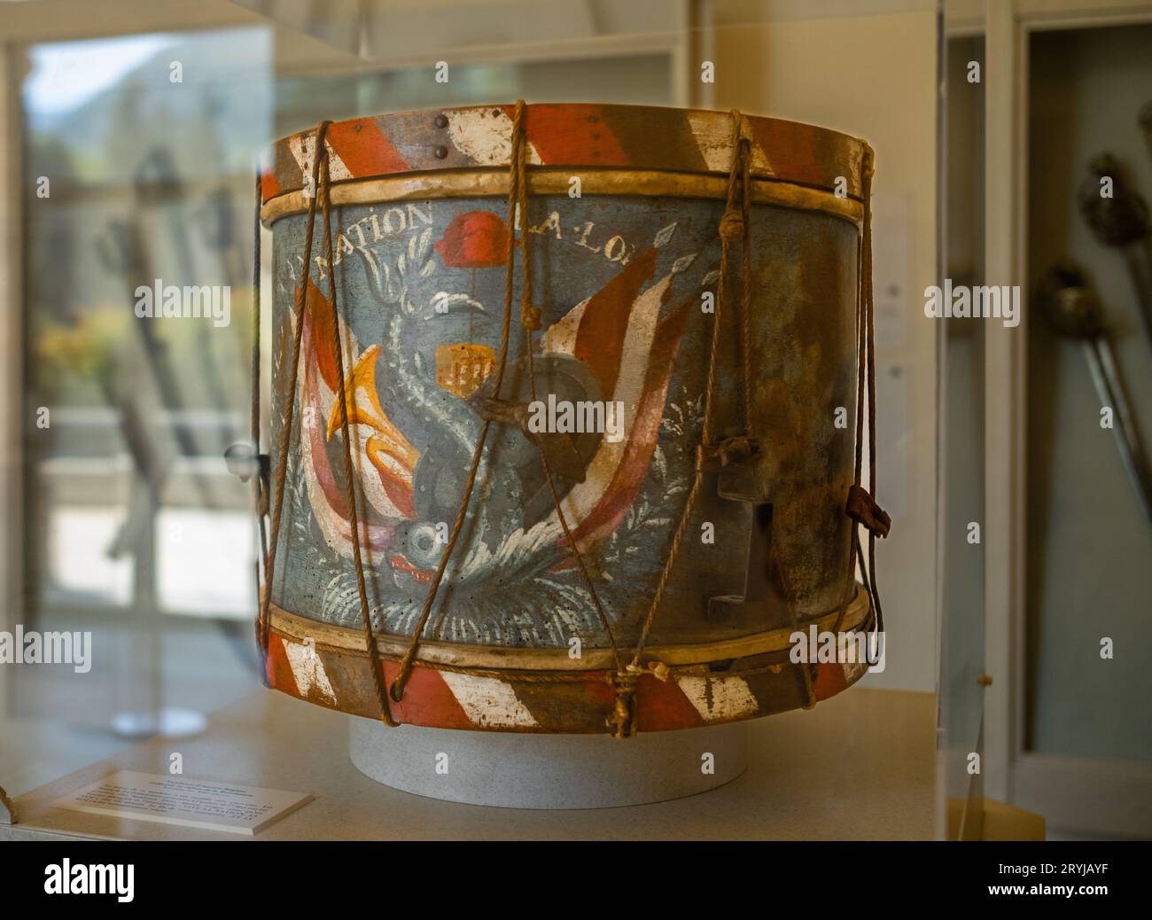 A military drum adorned with patriotic paintings and rope that dates to ...