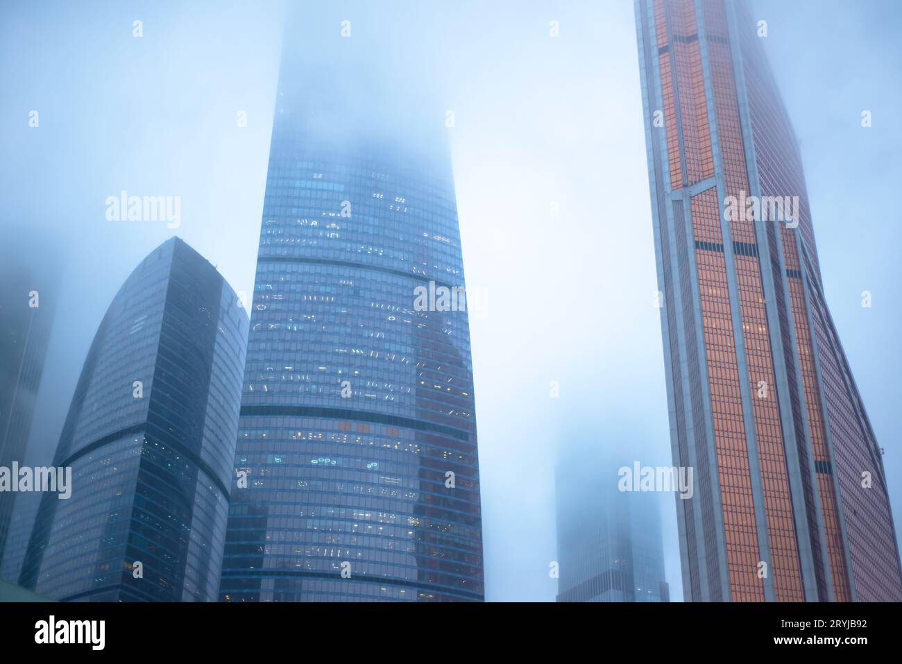 Skyscrapers rise into the foggy cloudy sky. Moscow City Stock Photo - Alamy