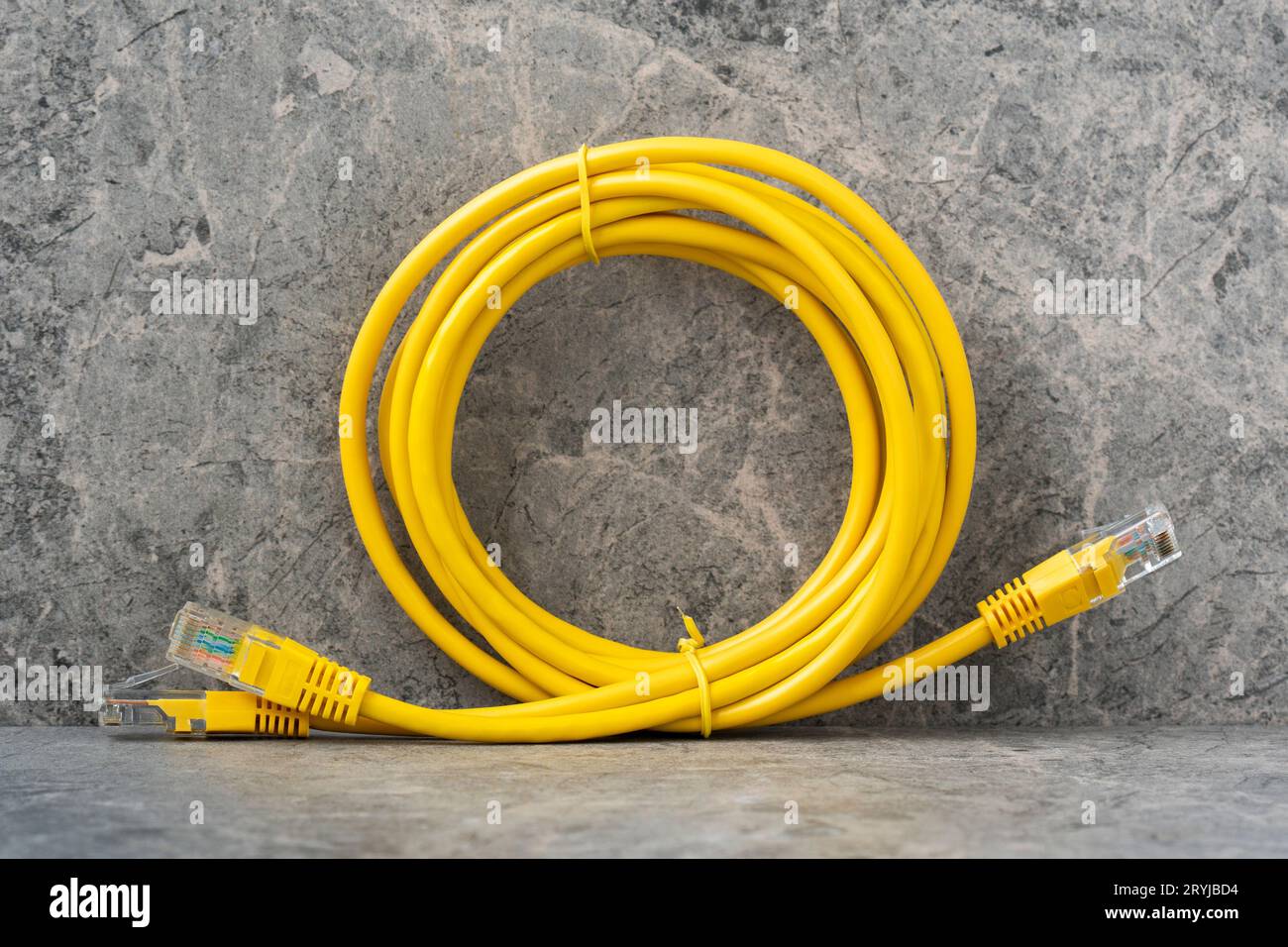 Internet cables RJ45 on the stone background Stock Photo - Alamy