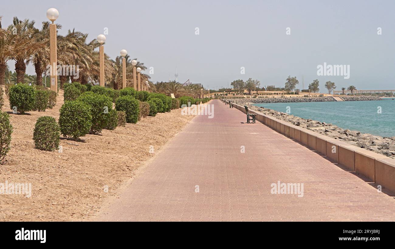 Empty coast walk promenade during hot summer day in Kuwait Stock Photo ...