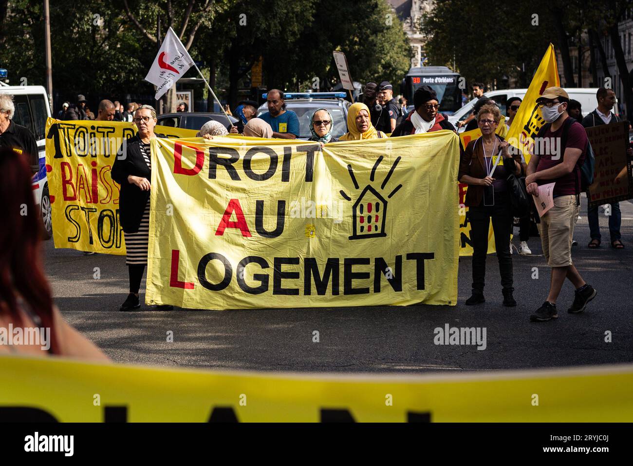 Protestors seen holding a banner with the message "Right to Housing ...