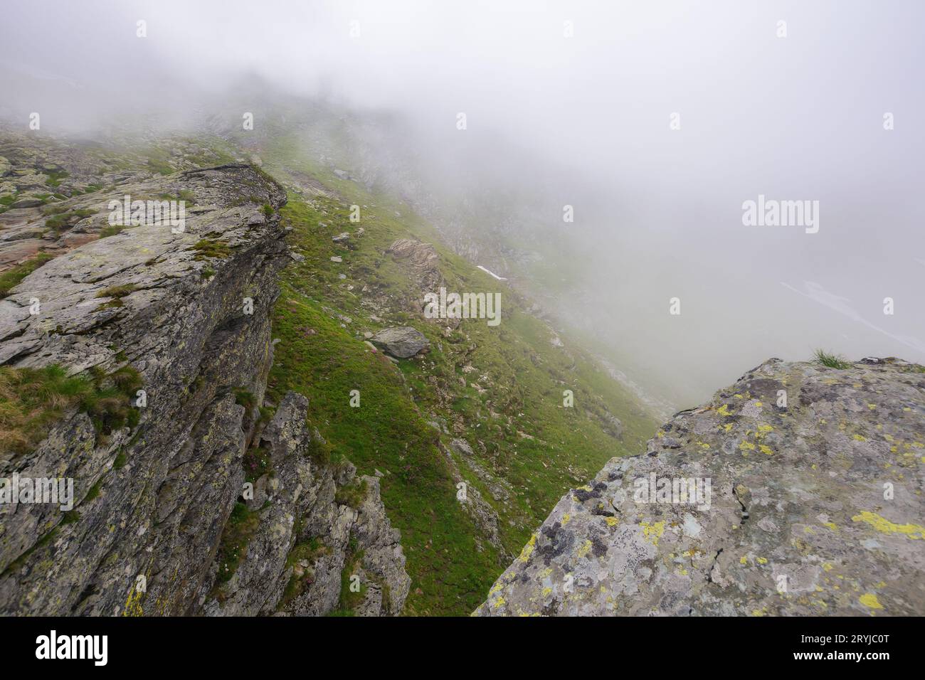 steep slopes of fagaras mountains, romania. rocks and boulders among ...