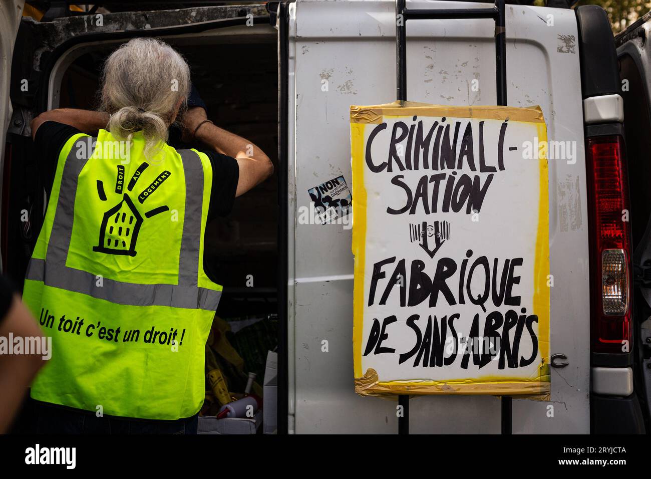 Paris, France. 30th Sep, 2023. A protester seen next to a placard that ...