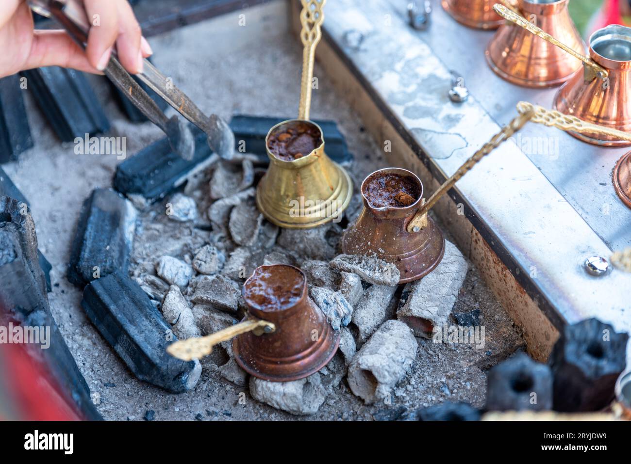 Making Turkish coffee with traditional methods , Coffee slowly cooking ...