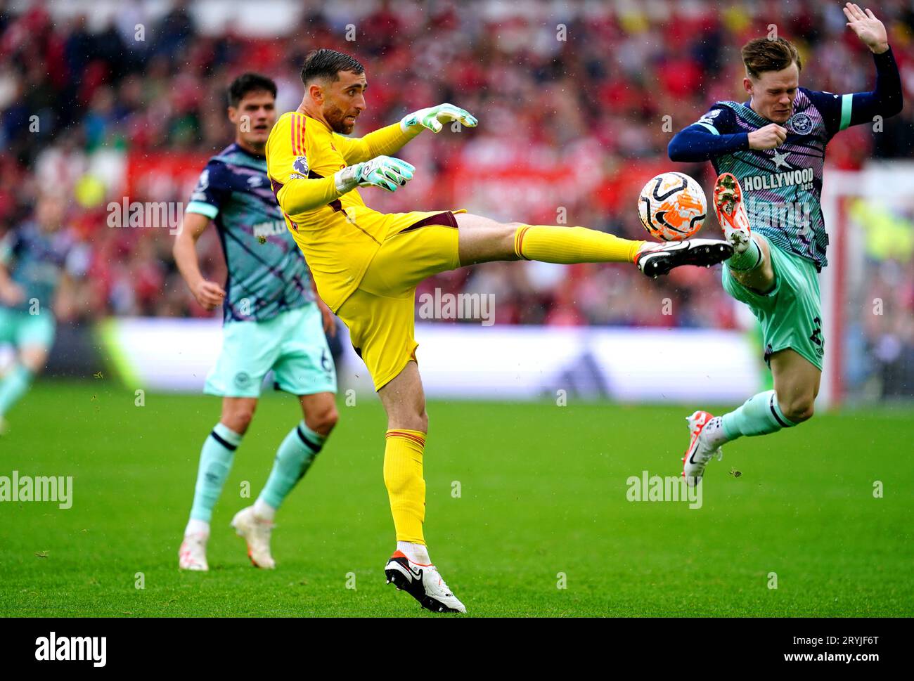 Nottingham Forest goalkeeper Matt Turner tries to clear the ball away ...
