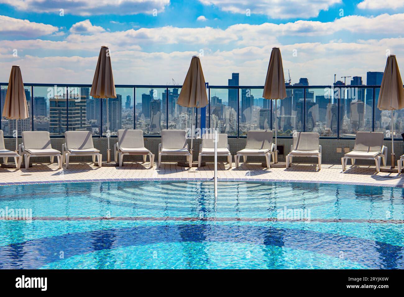 Lounge chairs around swimming hi-res stock photography and images - Alamy