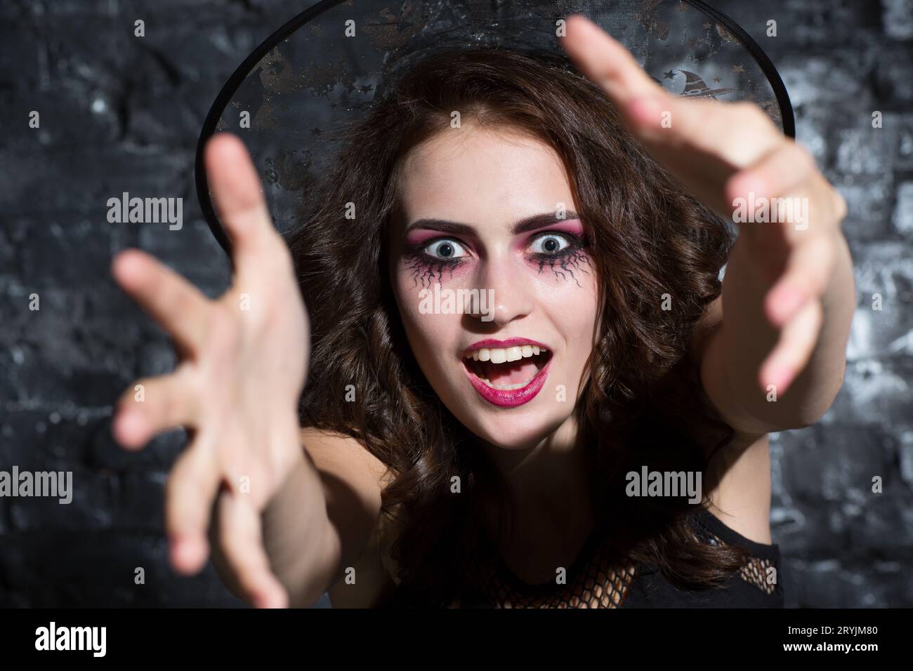 Zombie girl stretching hands toward camera and screaming Stock Photo ...