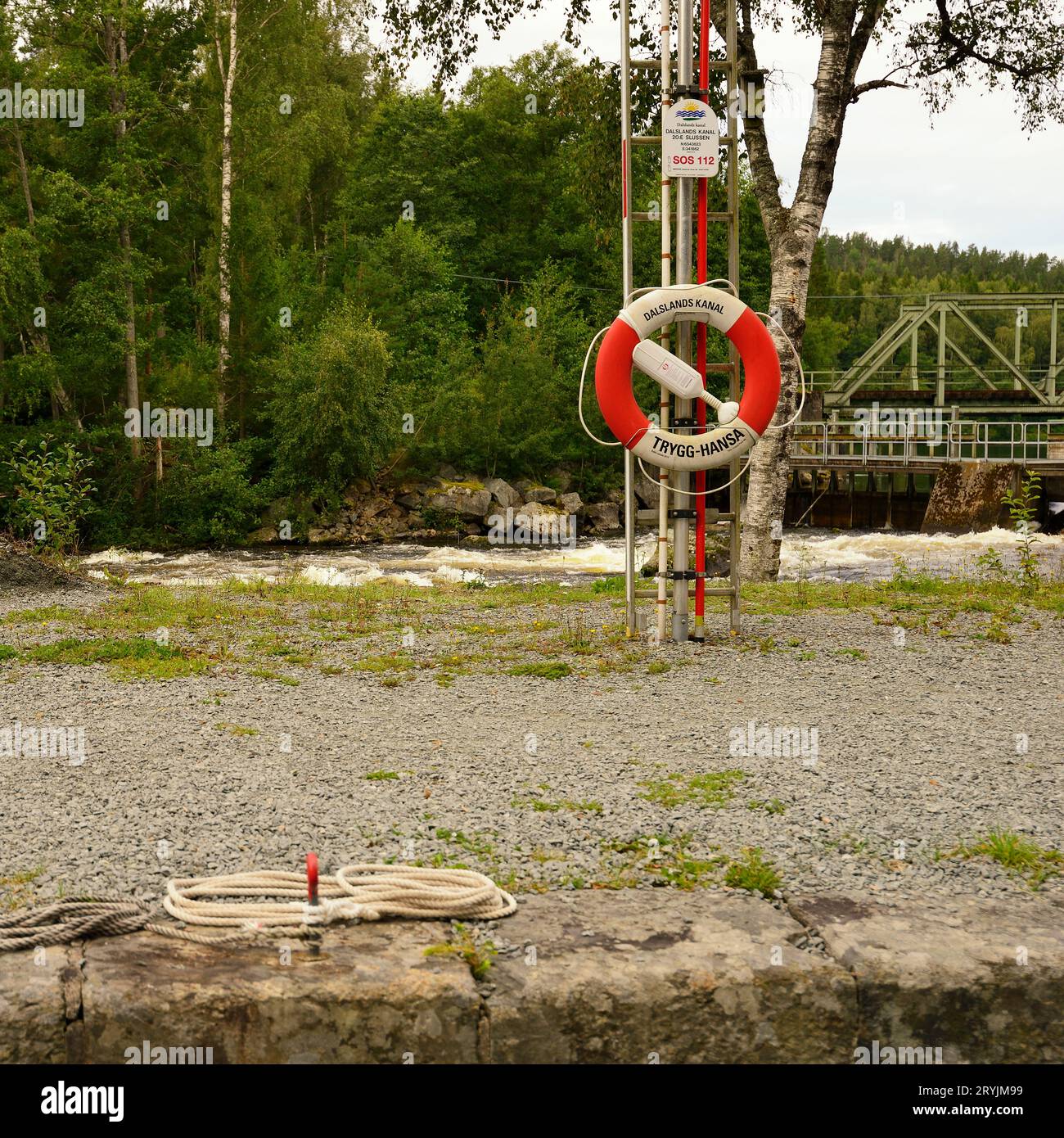 Sponsored lifebuoy, placed at the far end of a river Stock Photo - Alamy