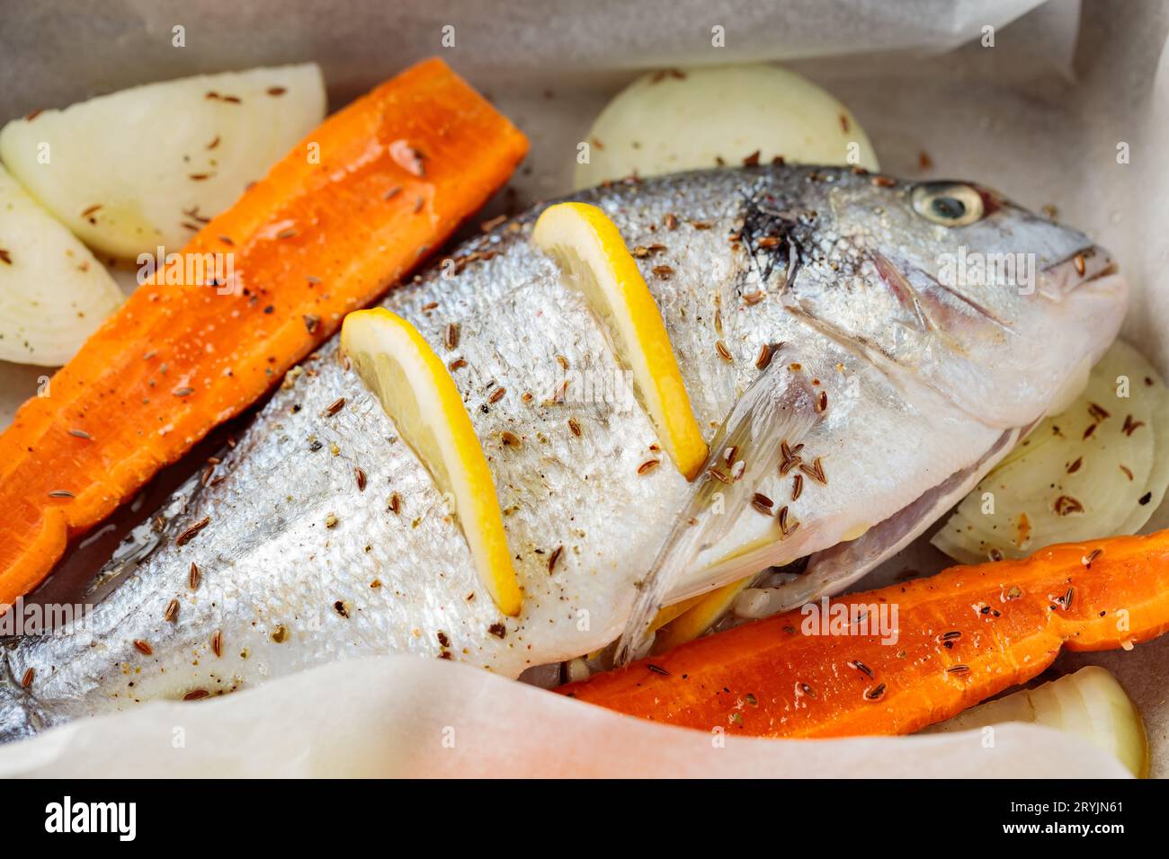 Dorado fish on baking sheet hi-res stock photography and images - Alamy