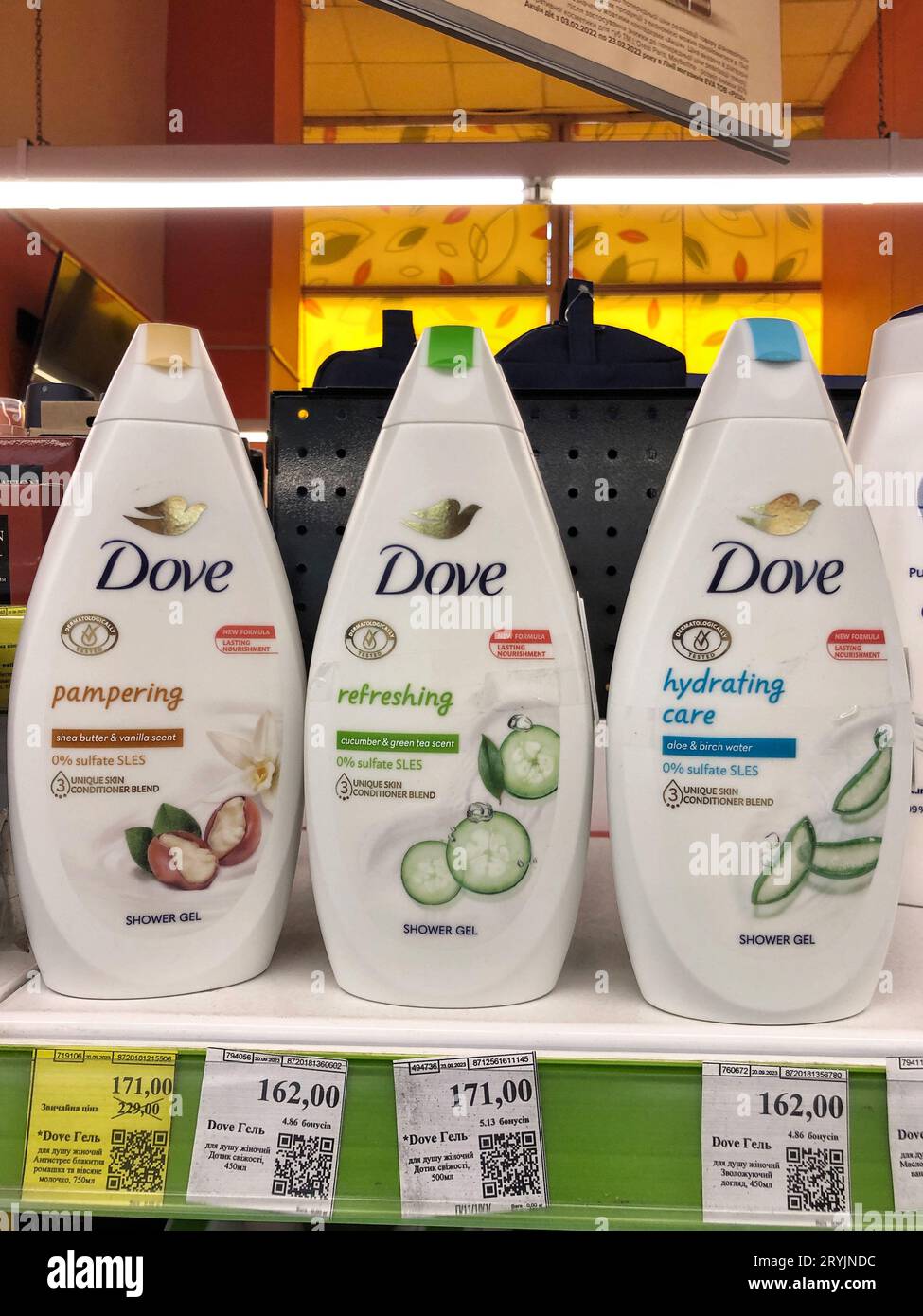 01.10.2023 Ukraine, Kharkov Large range of Dove brand shower gels on the shelves of a cosmetic ...