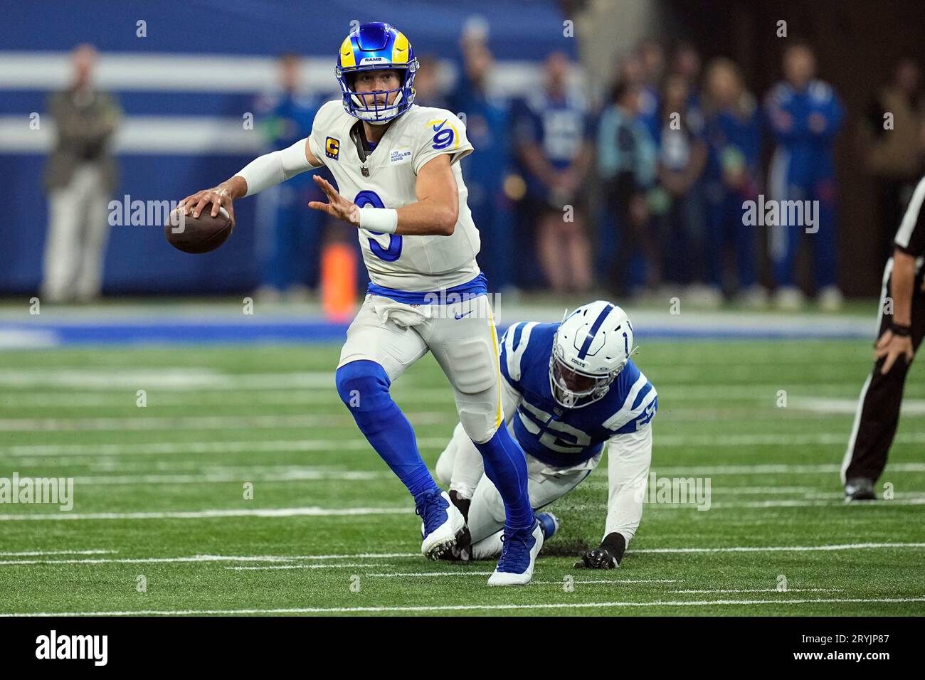 Los Angeles Rams quarterback Matthew Stafford scrambles as Indianapolis ...