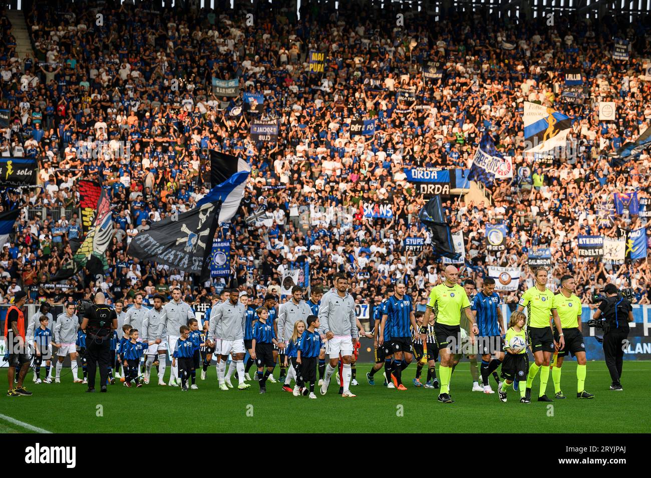 Bergamo, Italy. 1 October 2023. Players enter the pitch prior to the ...