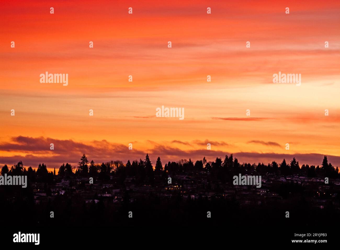 Suburban residential area on sunset sky background Stock Photo - Alamy