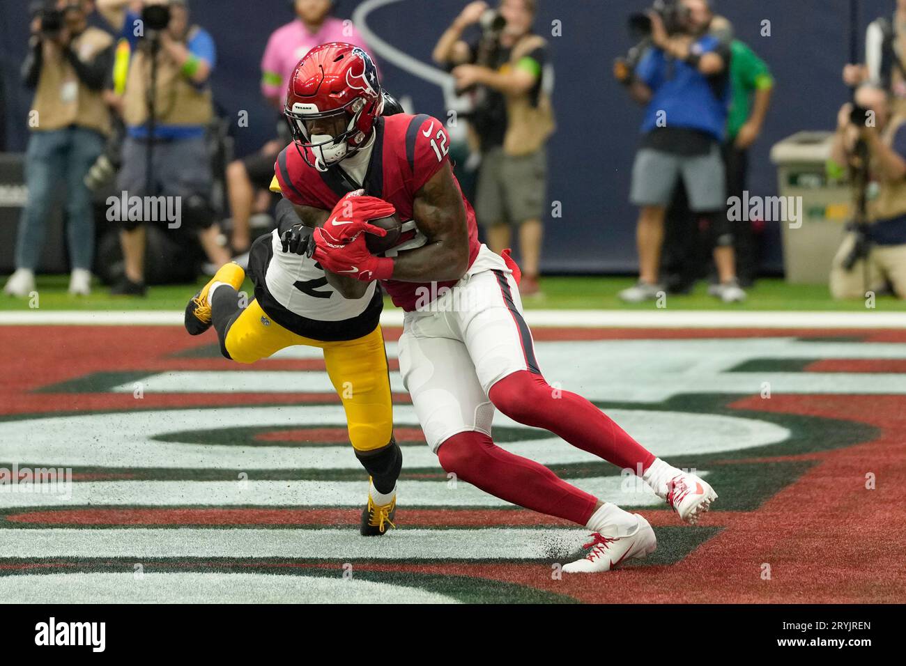 Houston Texans wide receiver Nico Collins (12) makes a catch for a ...