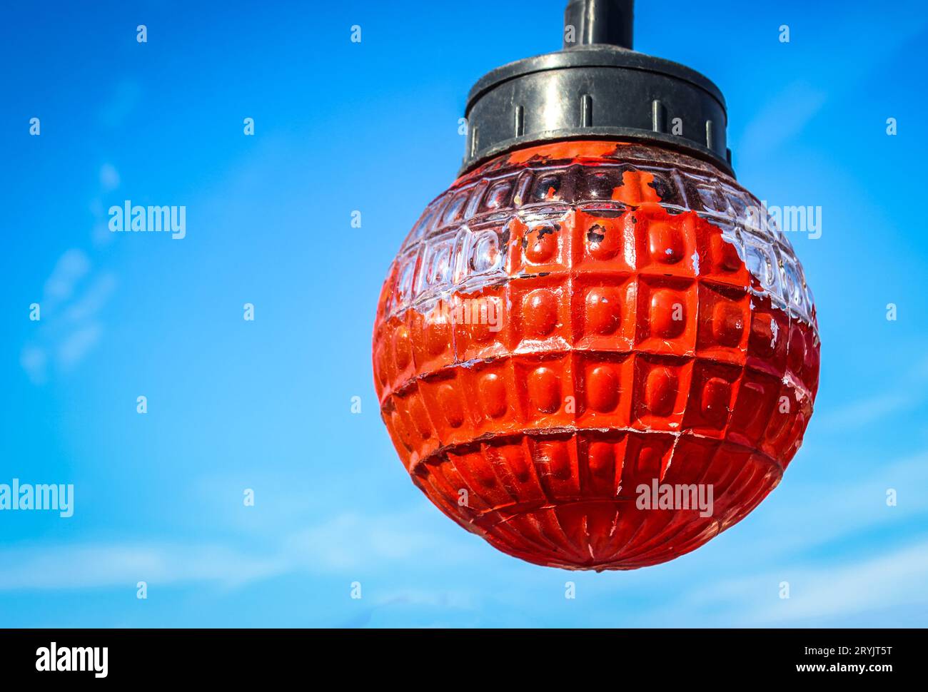 Red glass lantern on the sky background Stock Photo - Alamy