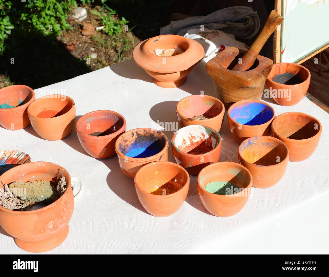 many terracotta bowls with colored finishes used for dyeing colors ...