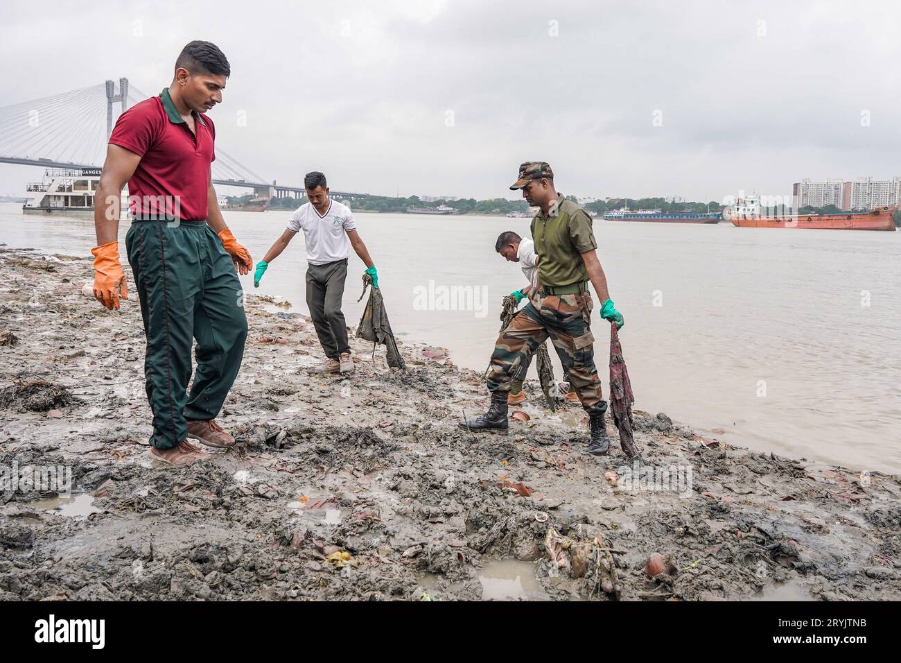 Army personnel of Gorkha Regiment clean the garbage on the bank of the ...