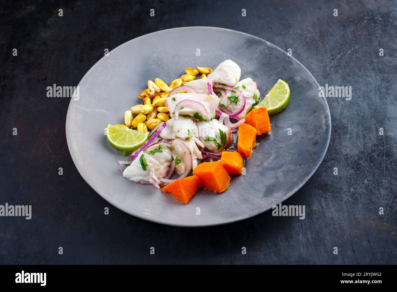 Traditional Peruvian gourmet ceviche sea bass filet piece with sweet ...