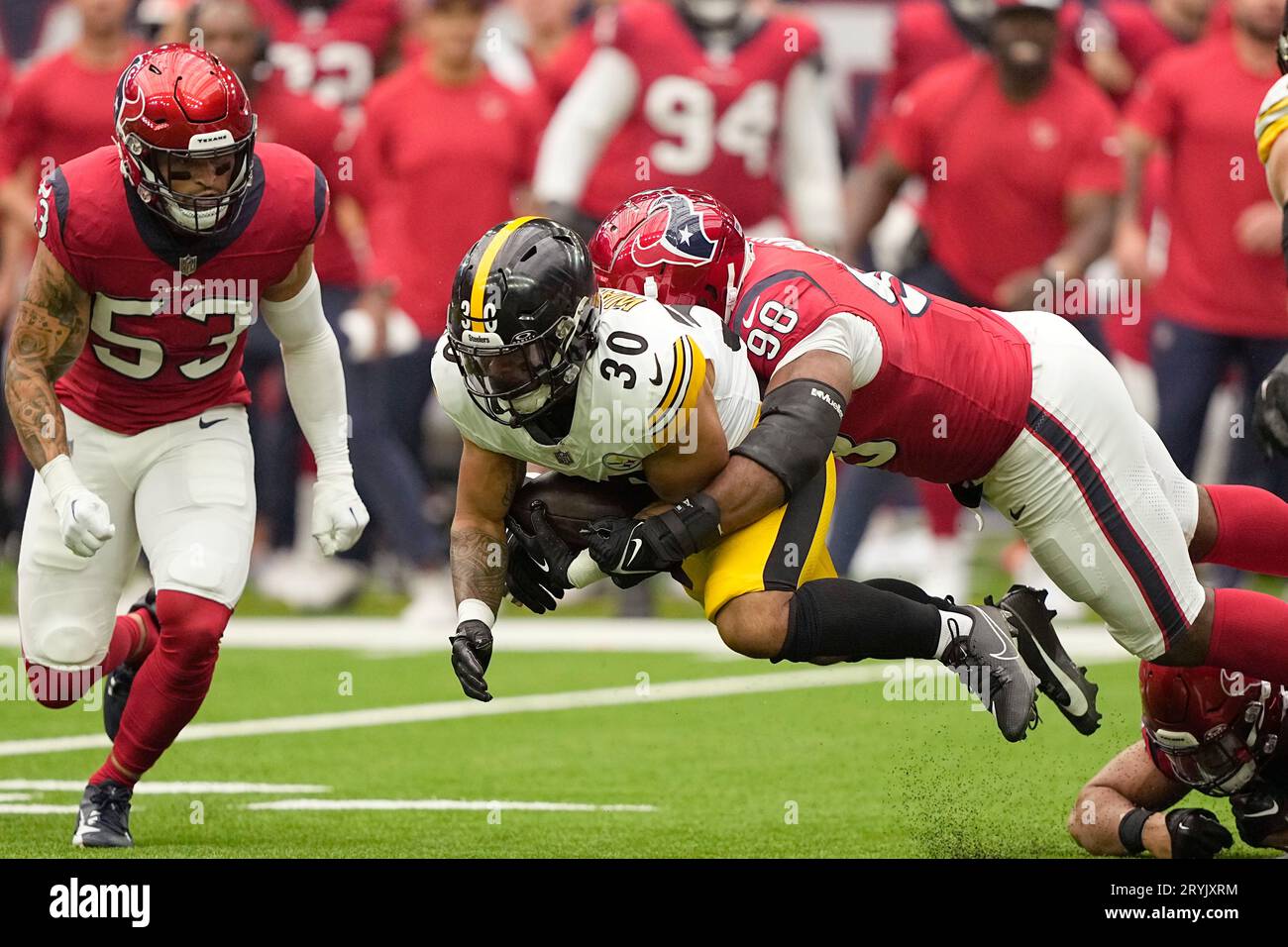 Pittsburgh Steelers running back Jaylen Warren (30) is hit by Houston ...