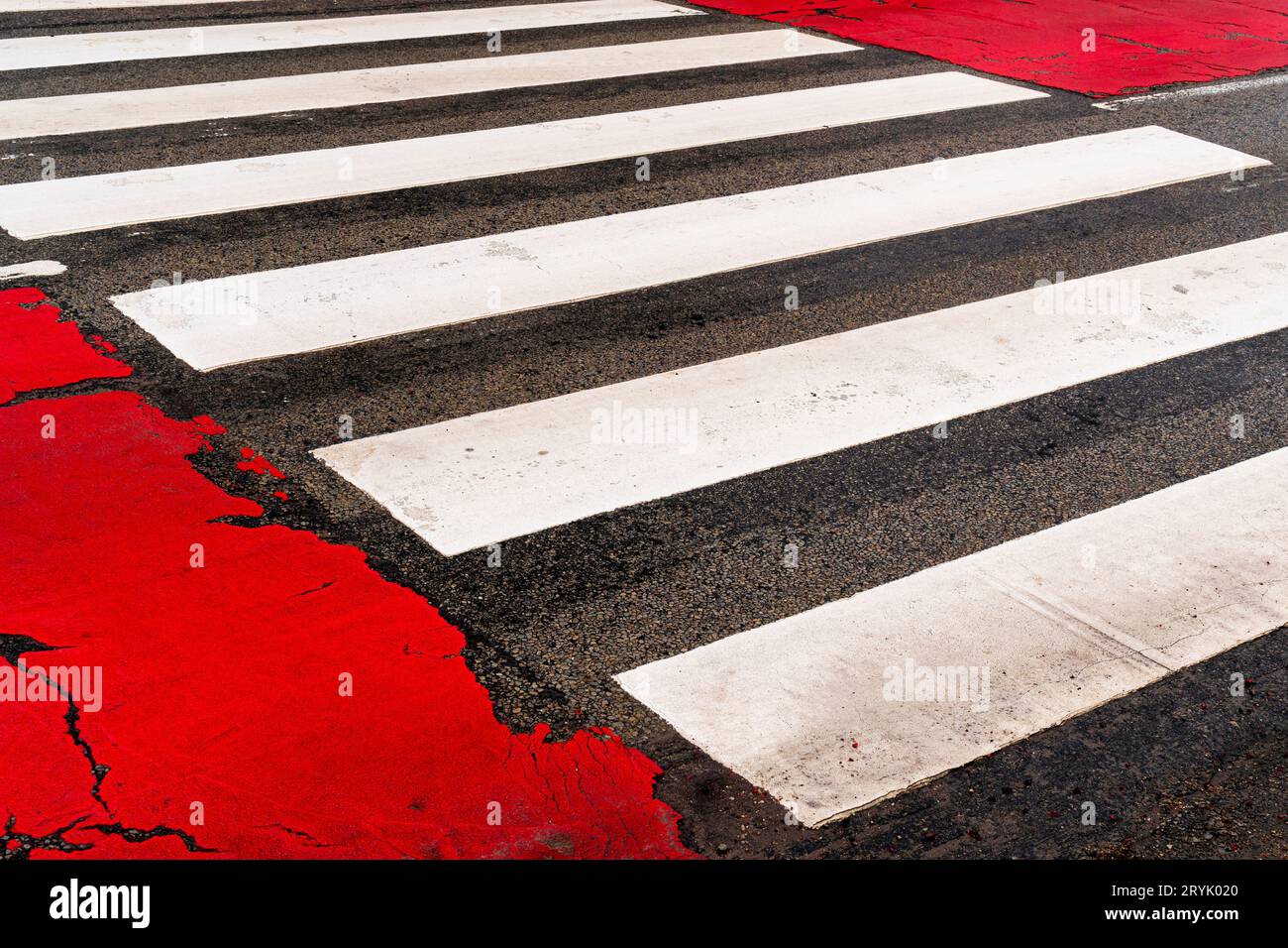 Markings of crosswalks and red rubber on the road Stock Photo - Alamy