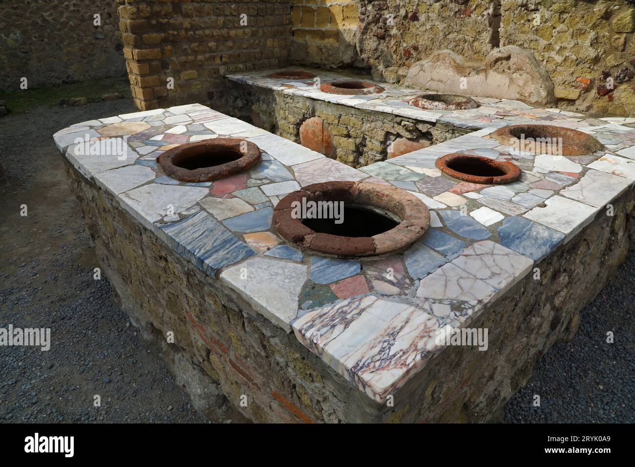 Ancient counter of a restaurant with pots for hot food, Pompei Stock ...