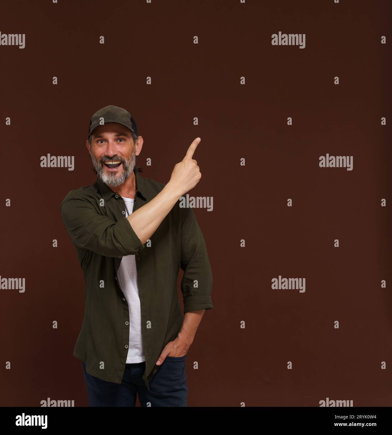 Advertising concept, mature European caucasian man pointing his finger ...