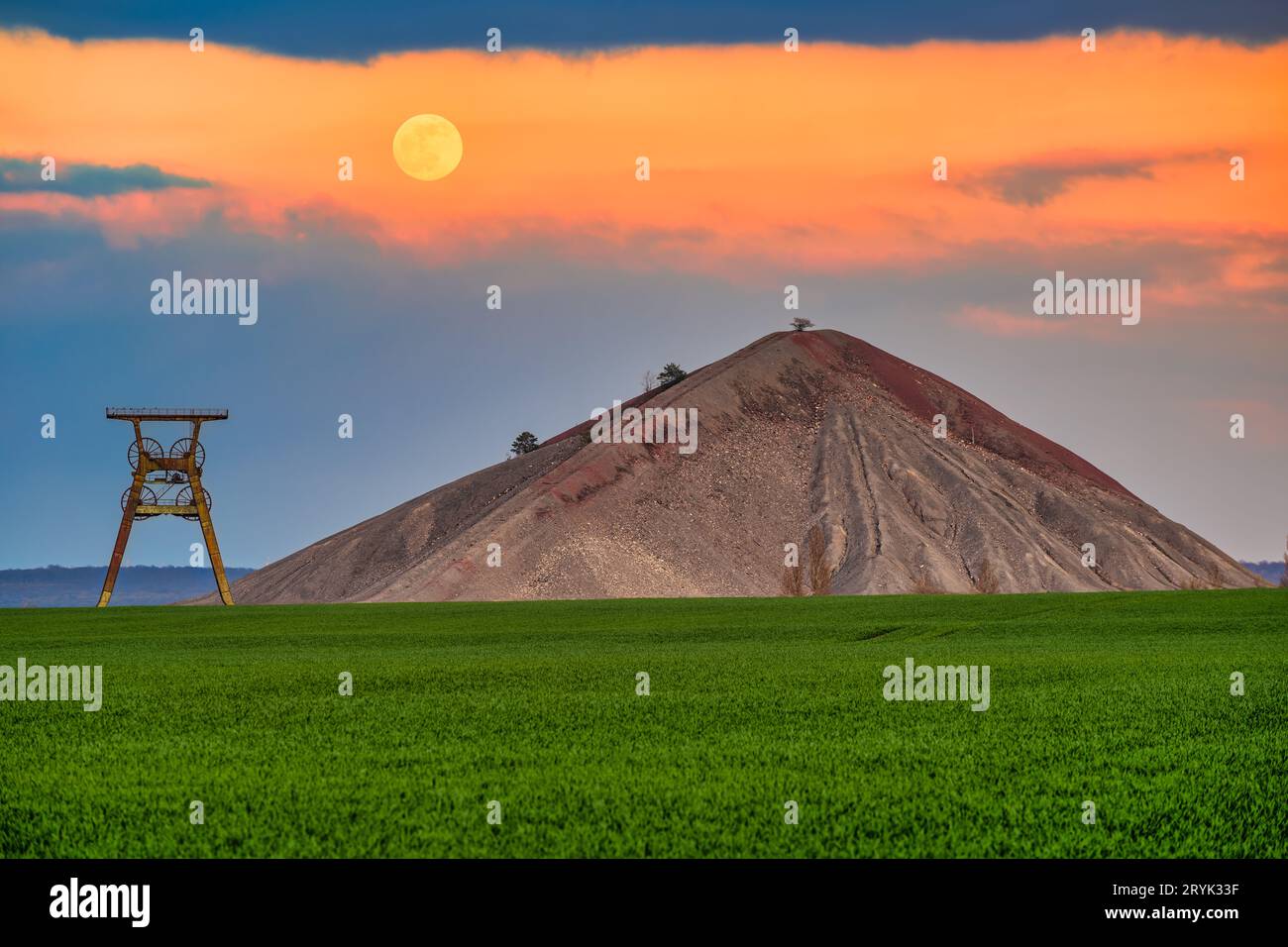 A view of an overburden heap in saxony-anhalt with a winding tower ...