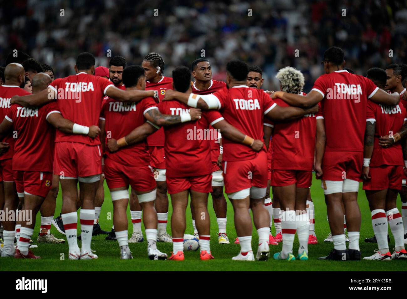 Tonga's players form a huddle during the warm-up before the Rugby World ...