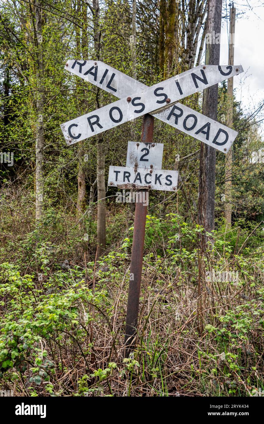 Old sign of railroad crossing on spring trees background Stock Photo ...