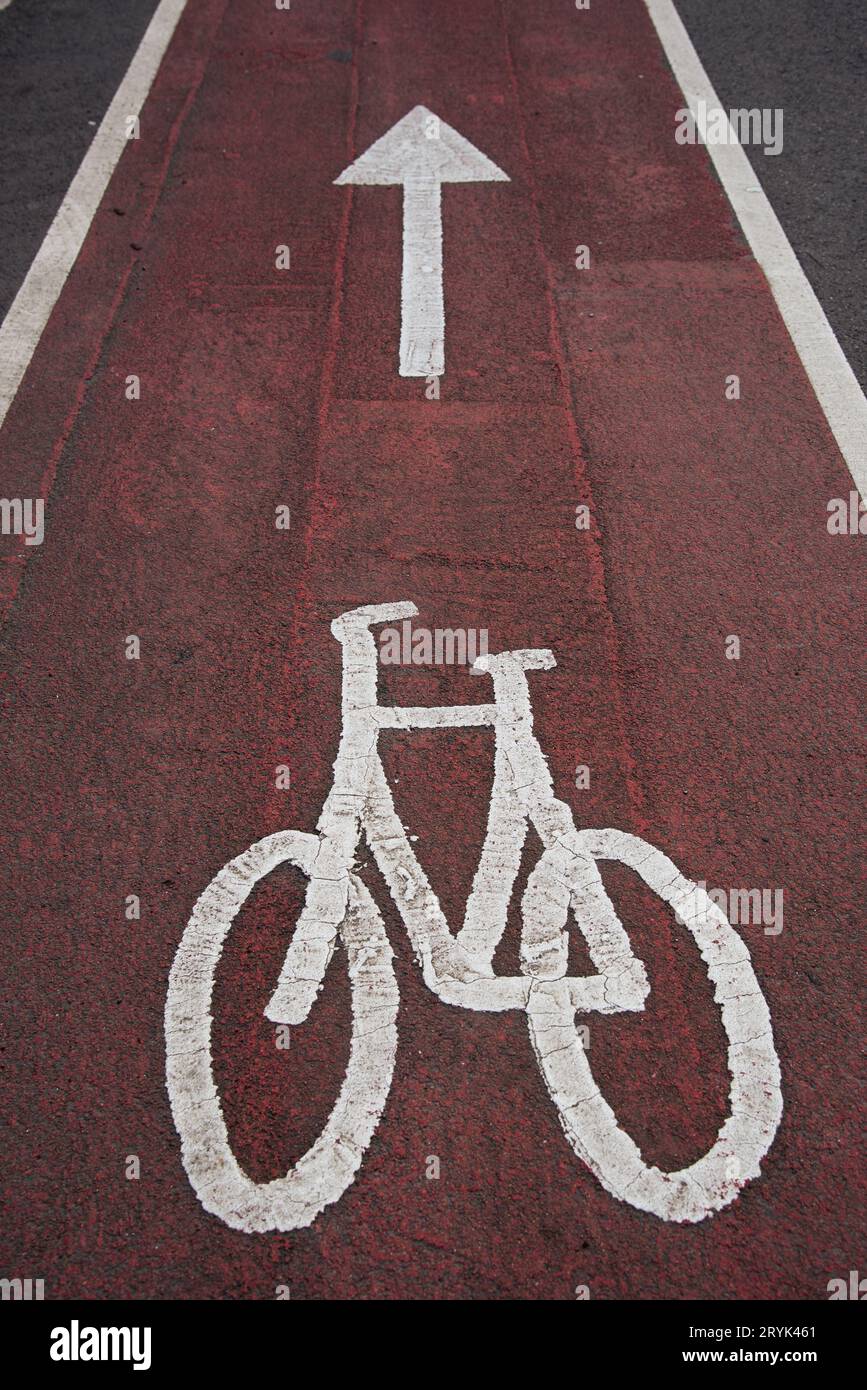 Bicycle lane with markings on asphalt in a city Stock Photo - Alamy