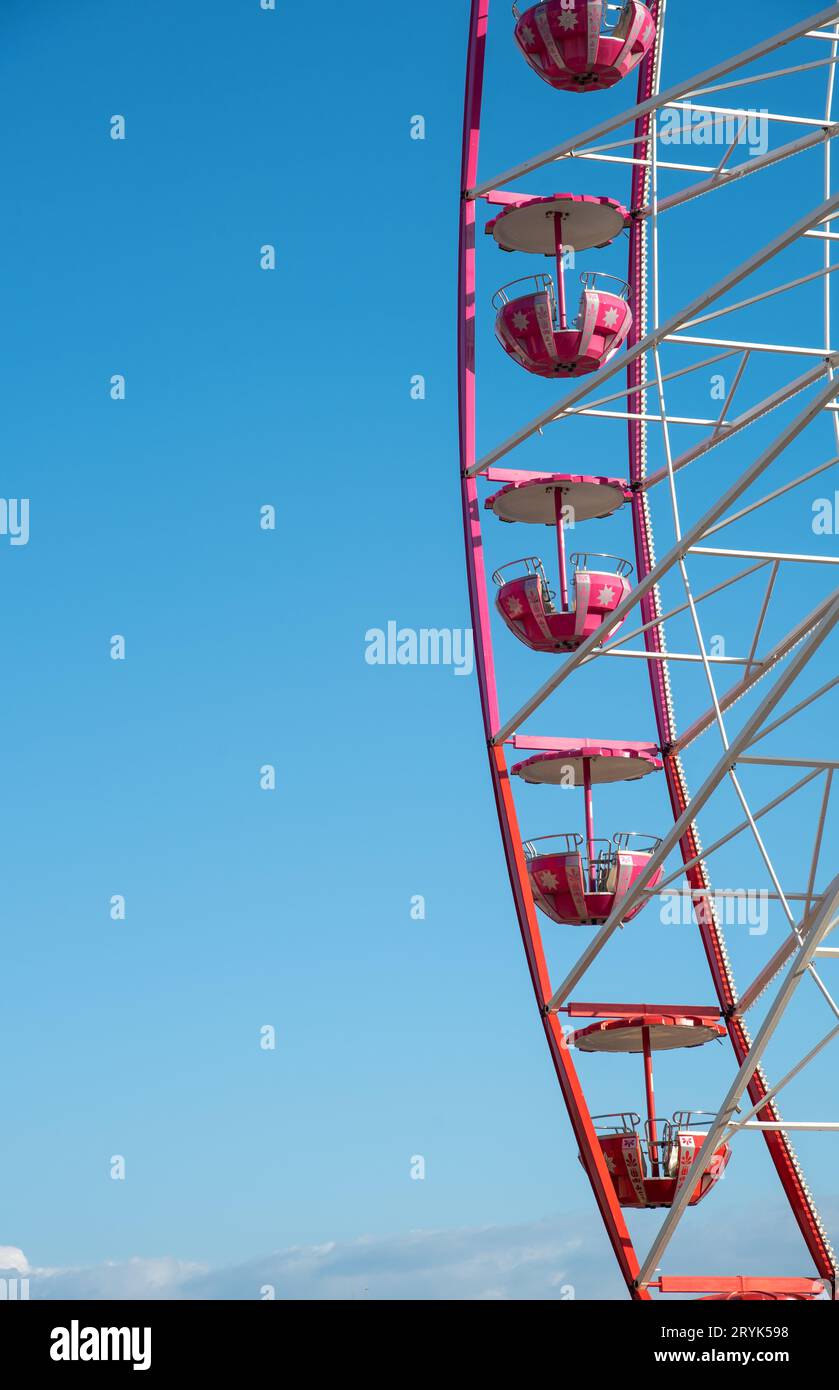Multicolour ferris wheel isolated on blue sky background, Having fun on ...
