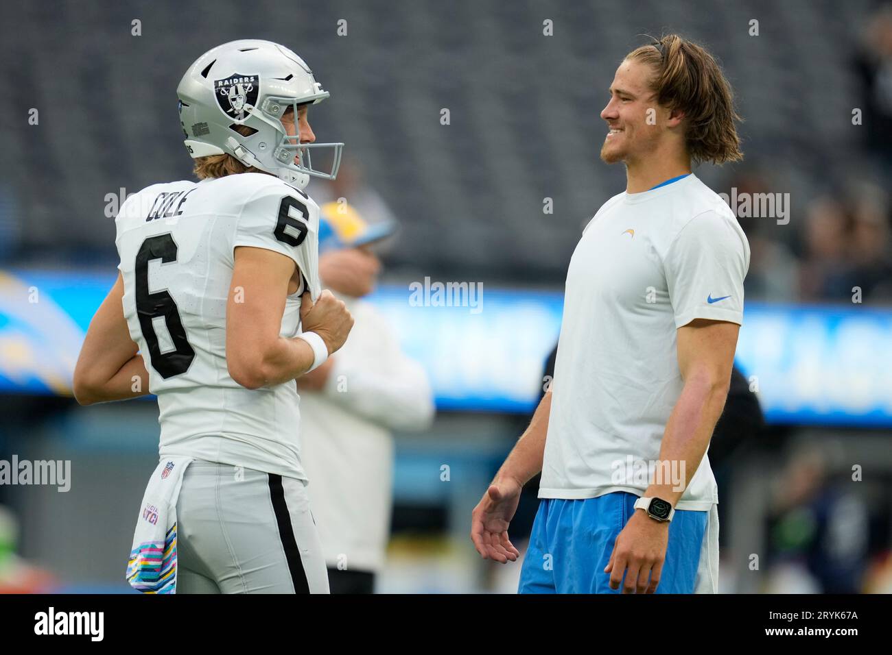 Los Angeles Chargers quarterback Justin Herbert, right, talks to Las ...