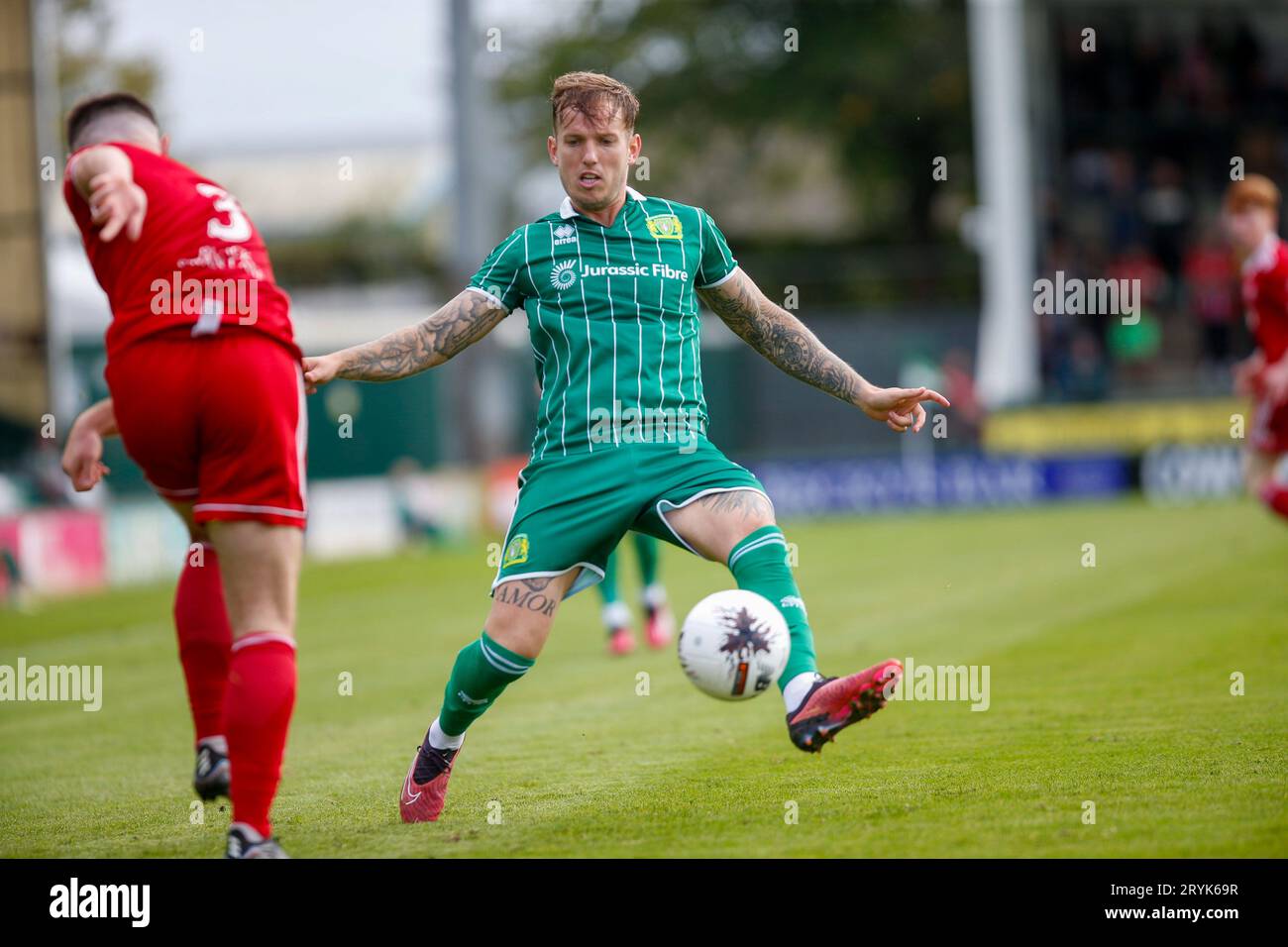 Jordan Maguire-Drew of Yeovil Town and Cameron McNeil of Didcot Town ...