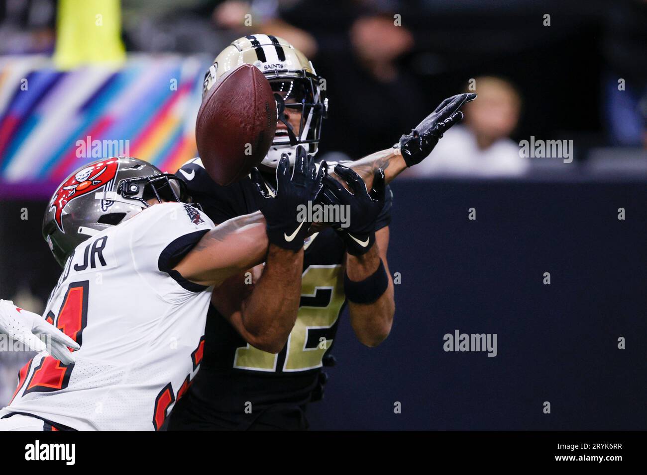 Tampa Bay Buccaneers safety Antoine Winfield Jr., left, disrupts a pass ...