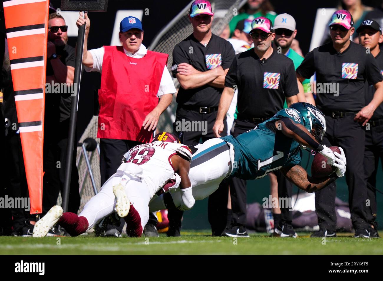 Philadelphia Eagles running back Kenneth Gainwell (14) is tackled by ...