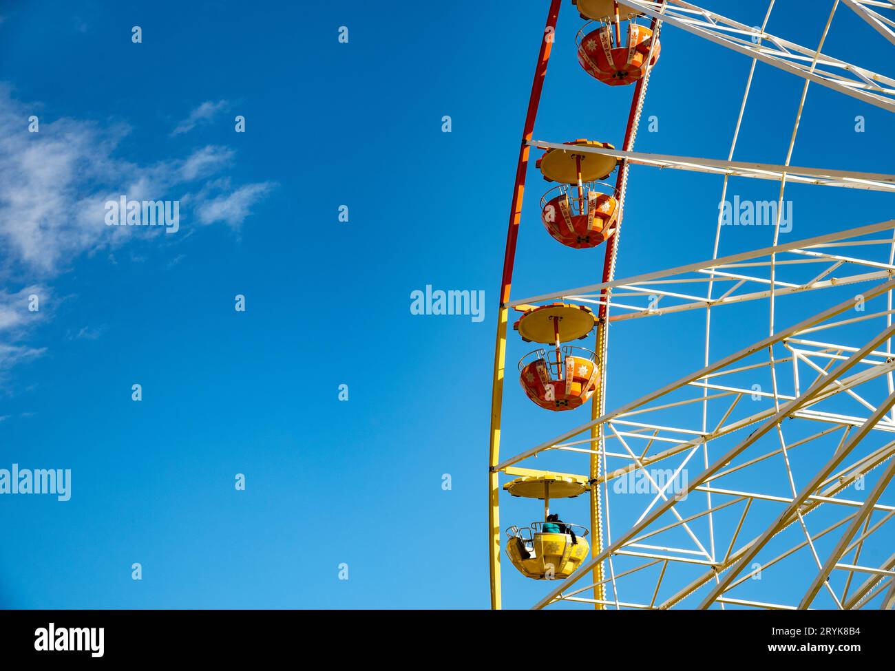 Multicolour ferris wheel isolated on blue sky background, Having fun on ...