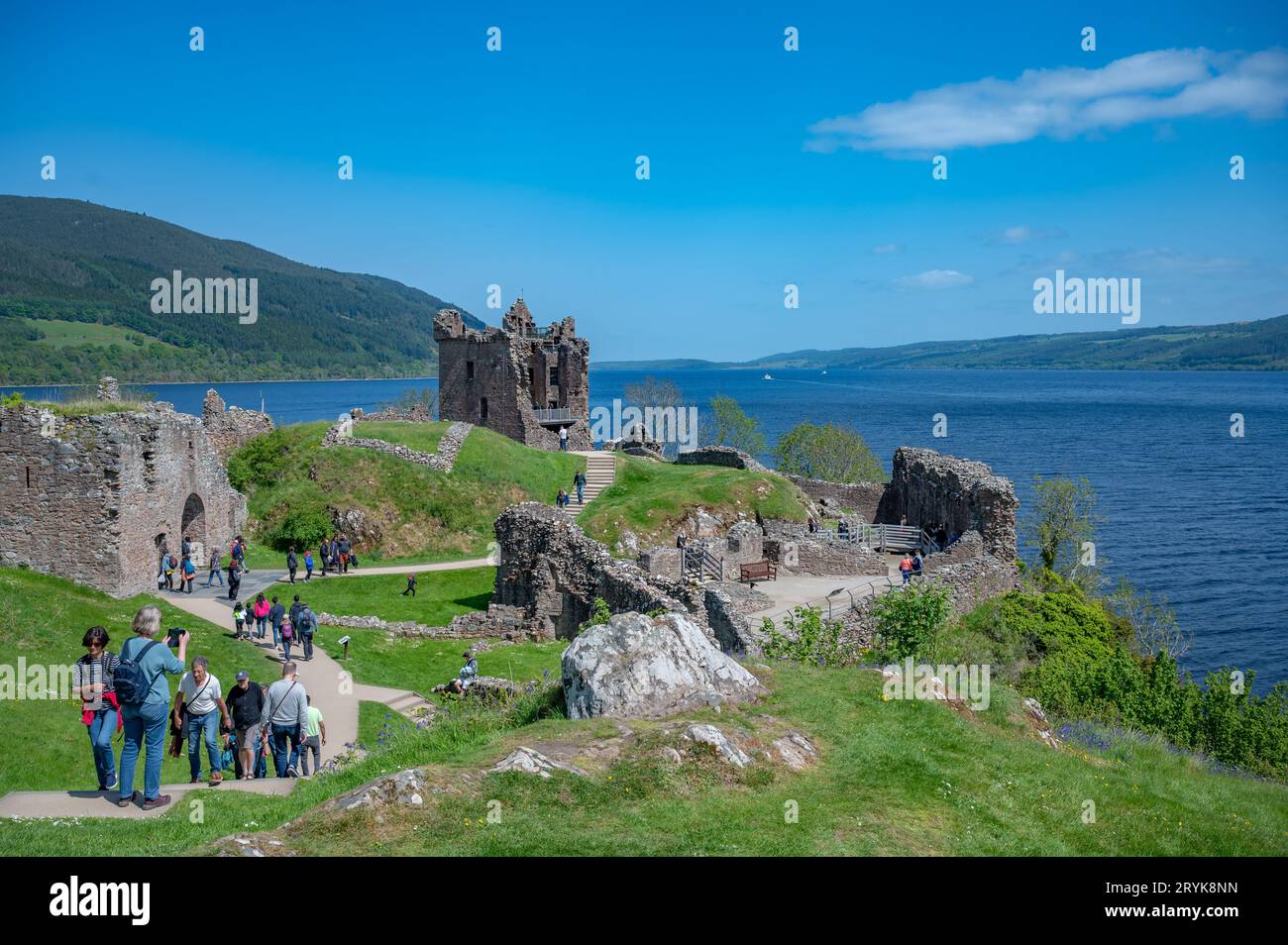 Urquhart Castle with tourist walking around, Loch ness lake in the ...