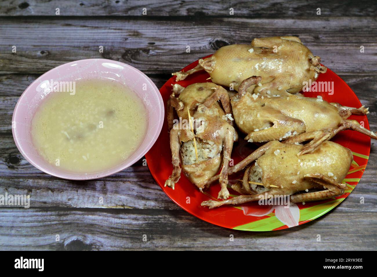Boiled white rice stuffed pigeons or Hamam mahshi and its soup with ...