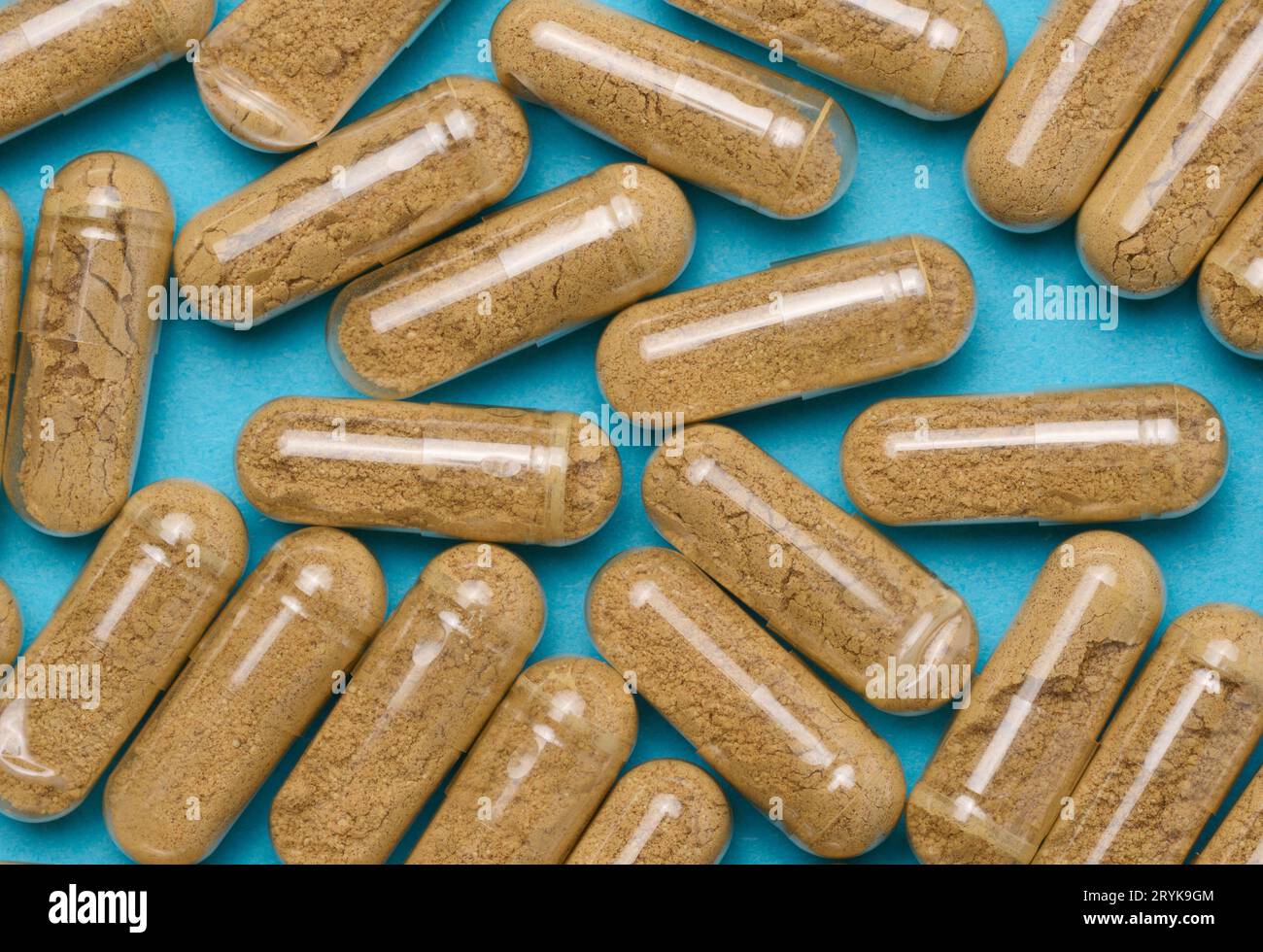 Transparent medical capsules on a blue background, tablets for ...