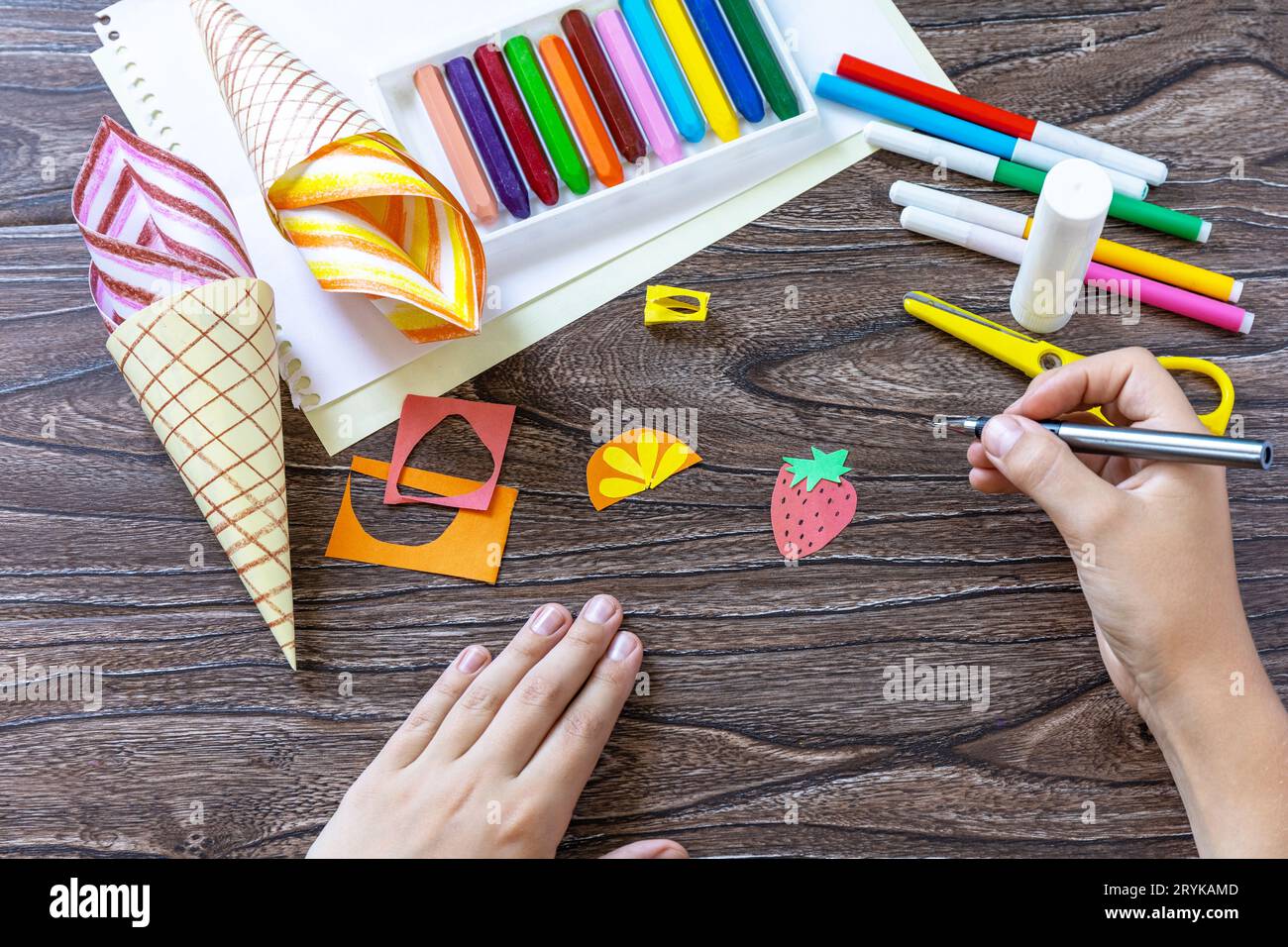 Instruction step 10. Paper Fan paper ice cream on a wooden table ...