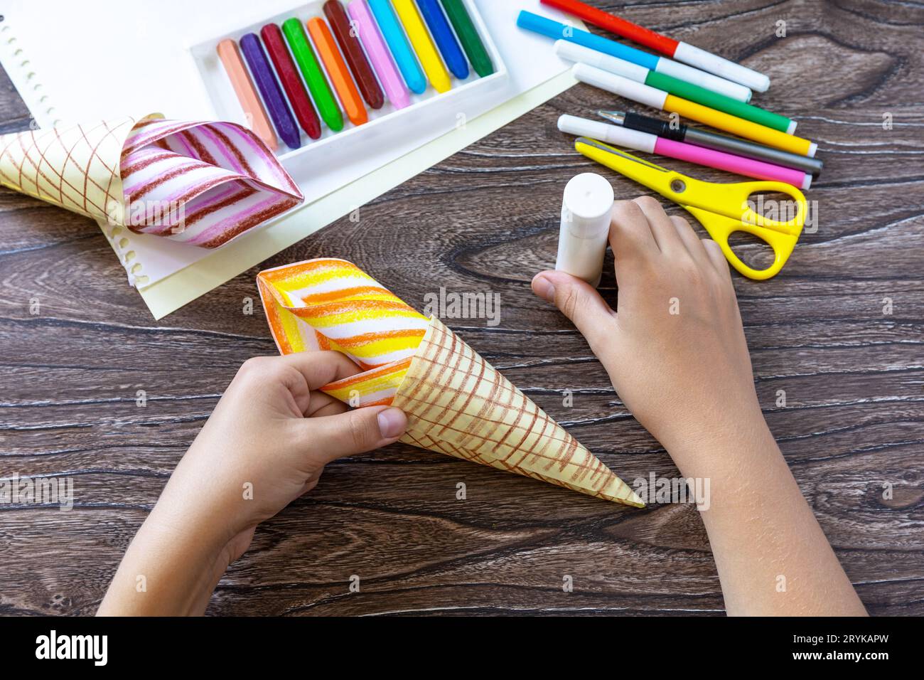 Instruction step 9. Paper Fan paper ice cream on a wooden table ...